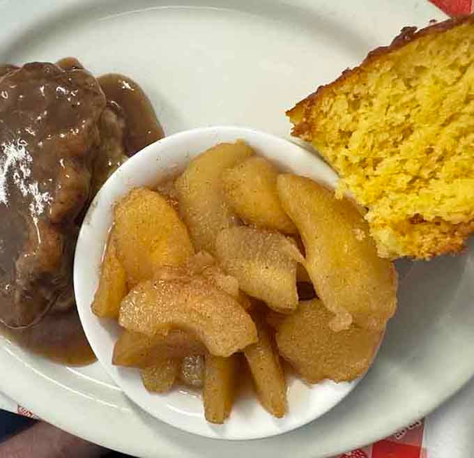 Behold the peach cobbler that launched a thousand return trips, complete with cornbread and what appears to be perfection.