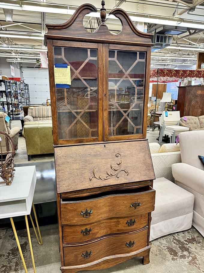 This secretary desk with its elegant curves could be the statement piece your living room has been missing.