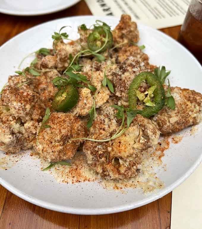 Mexican Street Cauli that'll make you forget you're eating vegetables, topped with jalapeños and pure deliciousness.