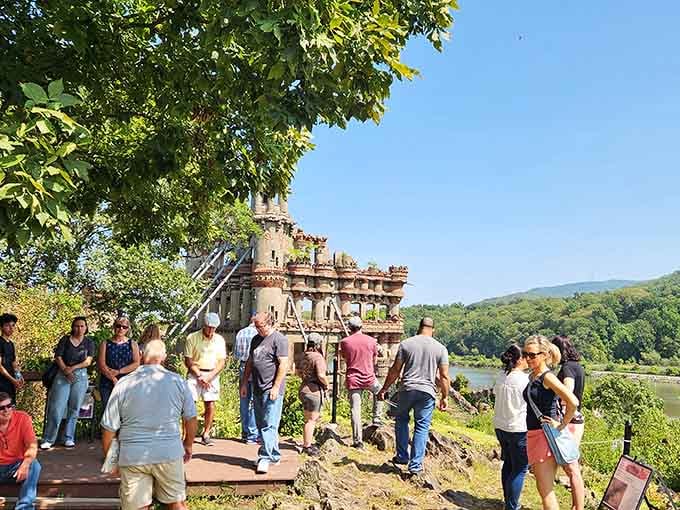 Tour groups gather to hear tales of explosions, entrepreneurs, and the eccentric vision that created this riverside wonder.