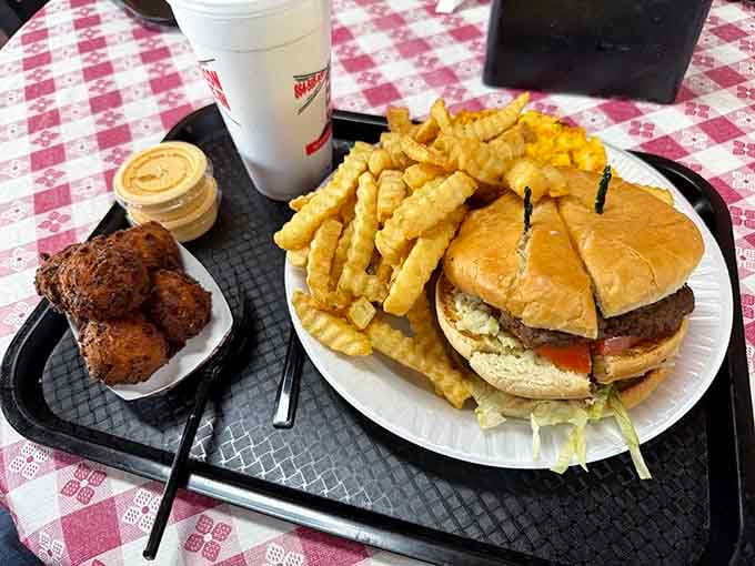 When your burger needs its own zip code and the fries could feed a small nation.