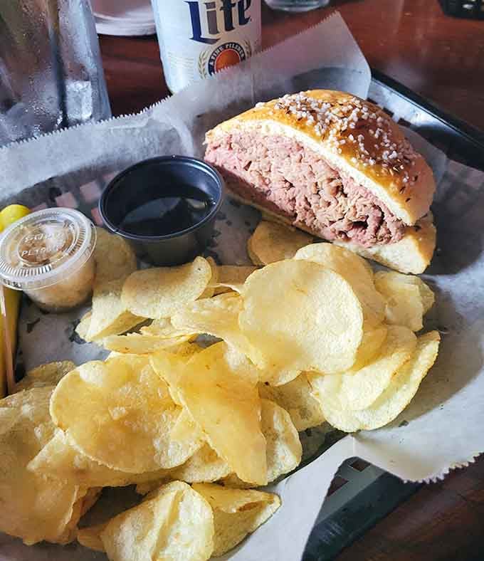 Behold the beef on weck in all its glory, complete with those essential salt-crusted kummelweck rolls and crispy chips.