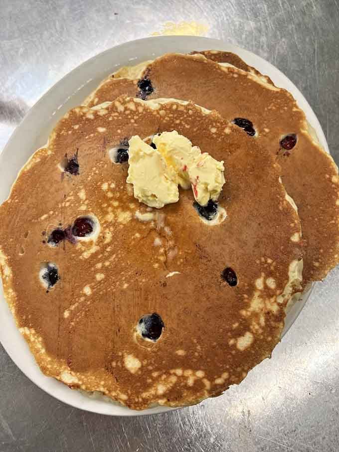 Blueberry pancakes so fluffy they could double as pillows, though eating them is considerably more satisfying than sleeping on them.