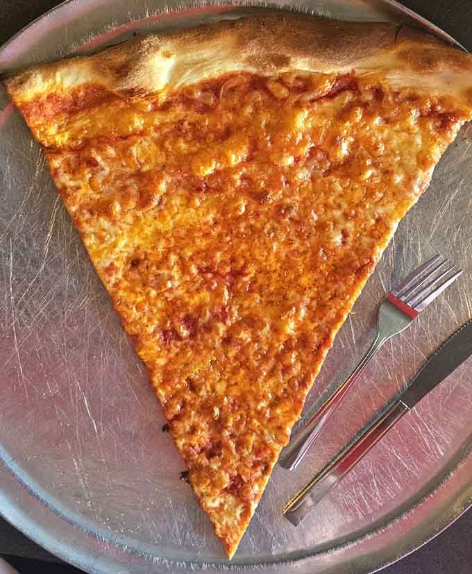 When your cheese slice needs a fork for structural support, you know you've entered the big leagues of pizza consumption.