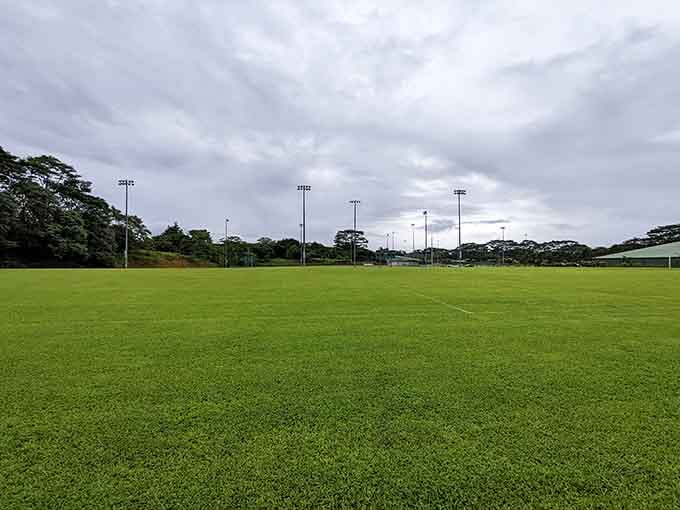 Pāhoa's community sports field &ndash; where weekend warriors play under skies that can't decide between sunshine and showers.