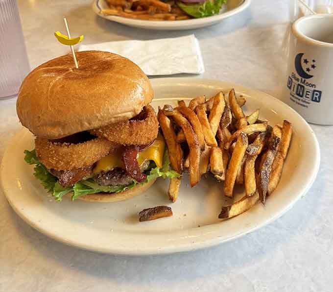 This burger stacked with onion rings proves that sometimes more is definitely more, and we're here for it.