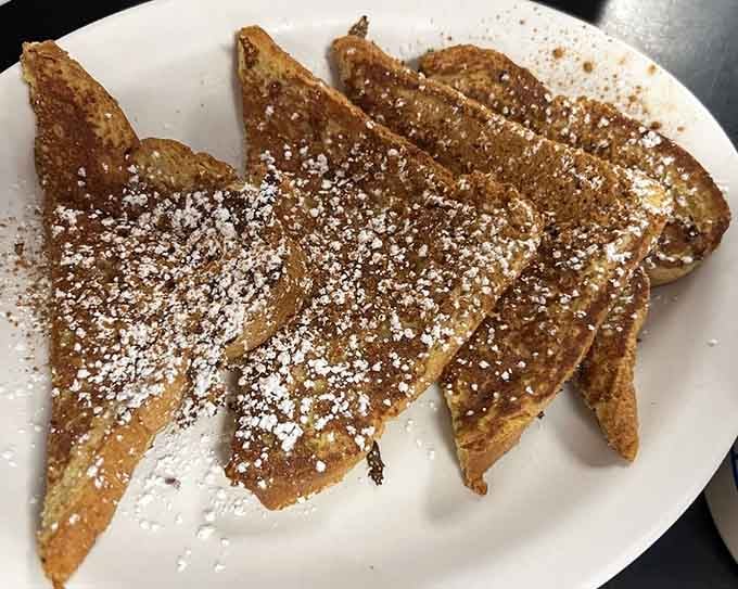 Golden French toast dusted with powdered sugar proves that sometimes the classics need absolutely no improvement whatsoever.