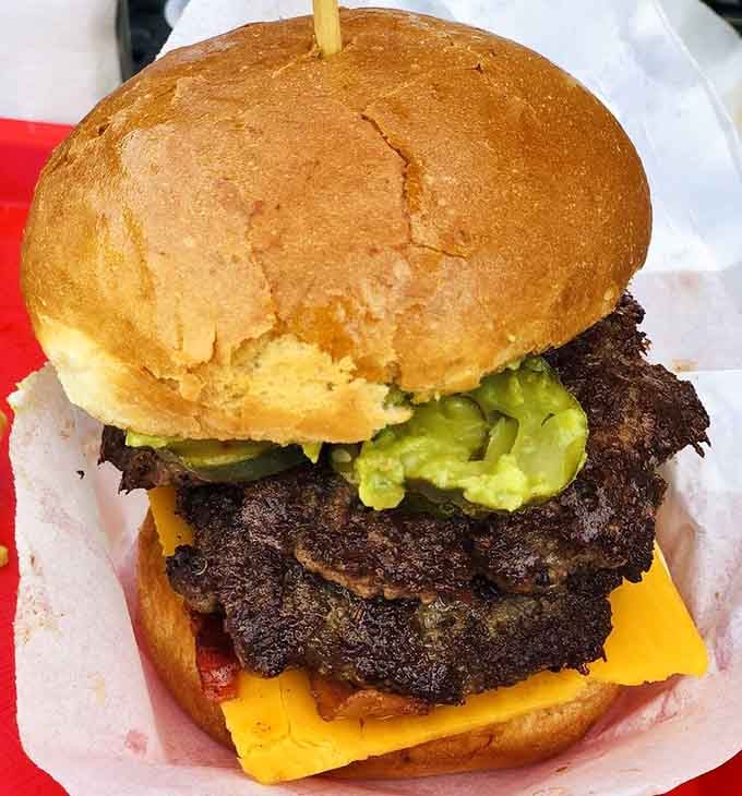 This double-decker beauty with guacamole proves that sometimes more really is more, especially when beef's involved.