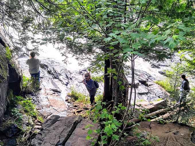 Fellow adventurers pause to soak in the view, because some moments demand you stop and stare.