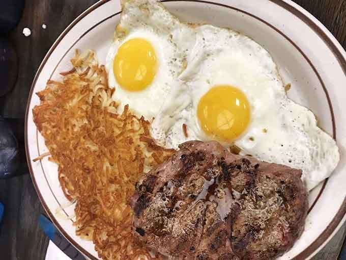 Sirloin steak with eggs and hash browns proves breakfast can be fancy without trying too hard to impress anyone.