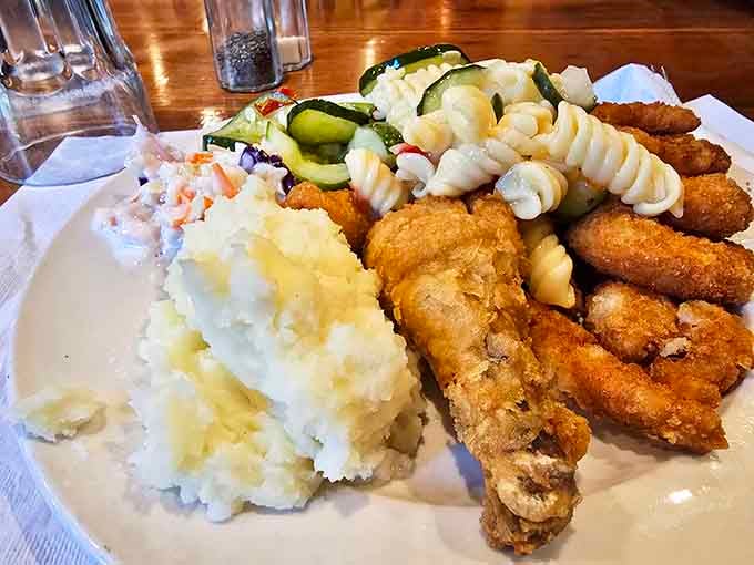 A plate that answers the eternal question: "Why choose one side when you can have four?" Crispy chicken, creamy potatoes, and pasta that demands attention.