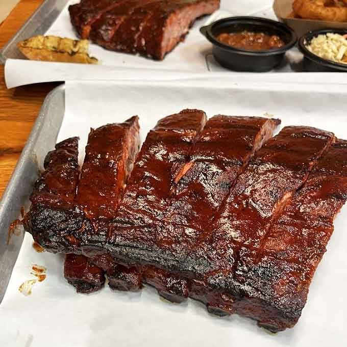These spare ribs have that perfect bark and smoke ring that'll make you believe in love at first bite.