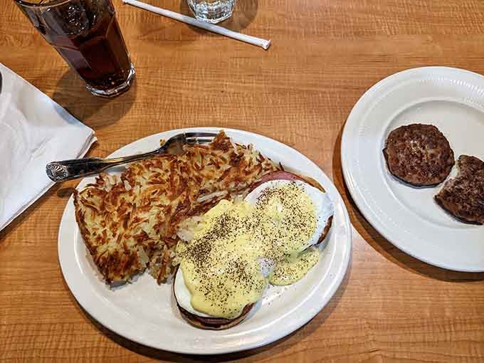 Eggs Benedict with hash browns that could double as edible gold, because starting your day right means starting it with hollandaise.