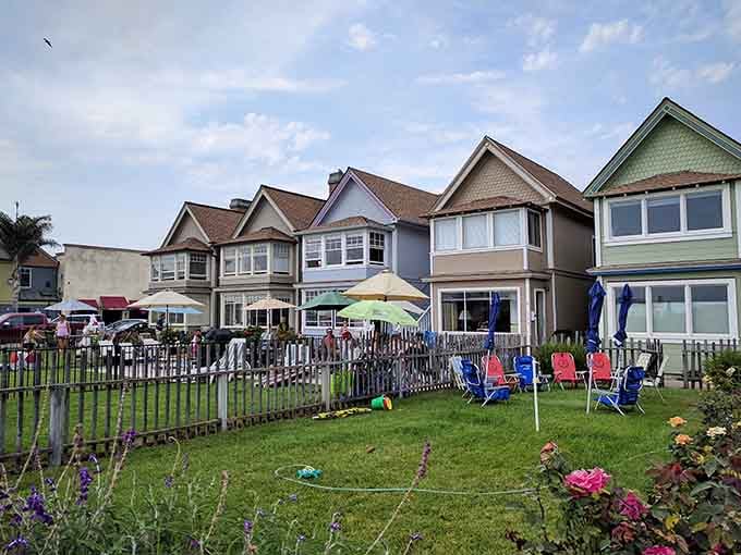 Victorian-style homes overlook the sand where families spread out without fighting for space like it's Black Friday.