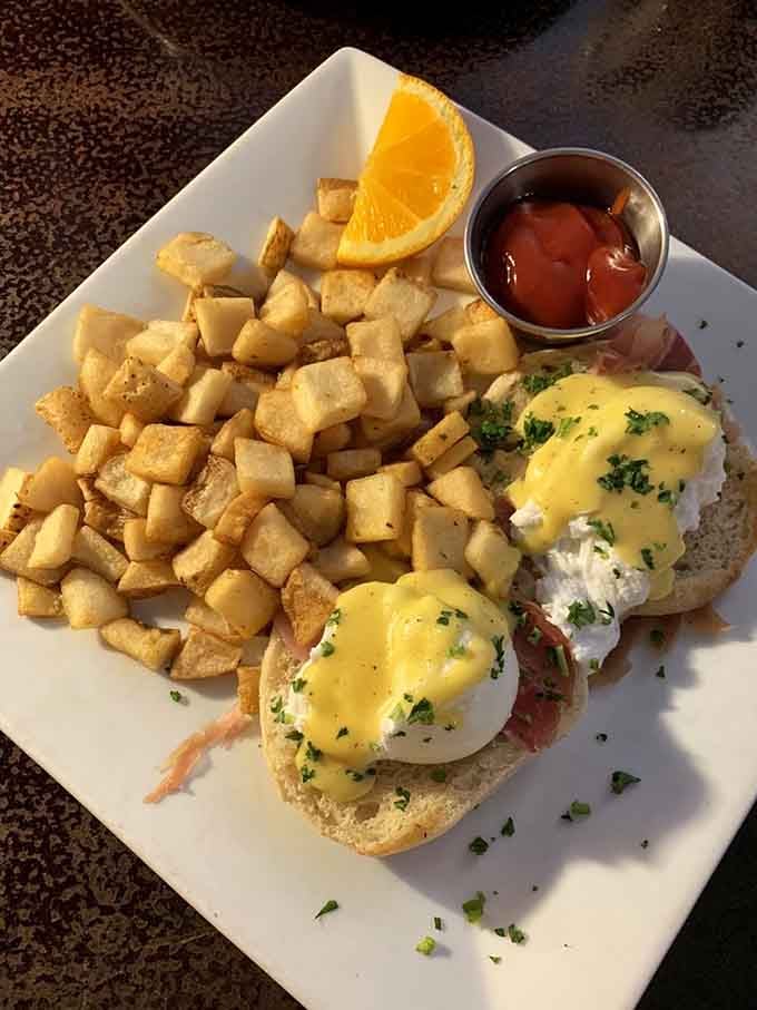Eggs Benedict done right, with hollandaise that flows like liquid gold over perfectly poached eggs and crispy potatoes.