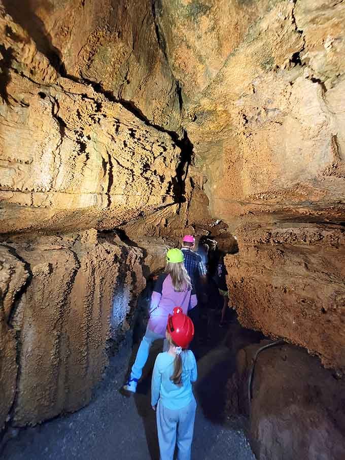 Inside Onyx Cave, ancient rock formations tower overhead like nature's own cathedral built over millions of years.
