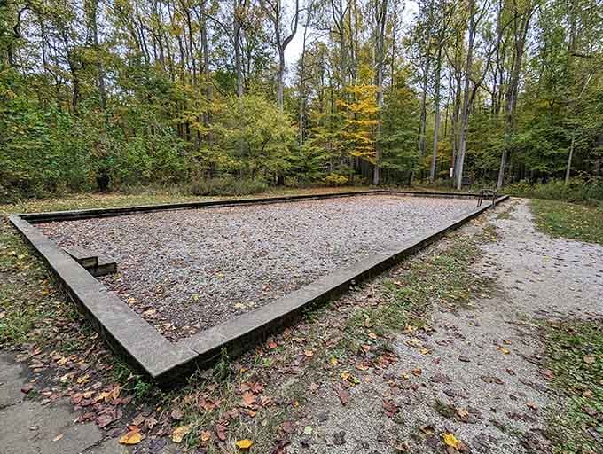 The old swimming pool foundation sits quietly, remembering summers filled with splashing kids and sun-soaked afternoons long past.