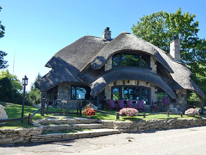 This thatched-roof beauty looks like it wandered off a British countryside and decided northern Michigan suited it just fine.
