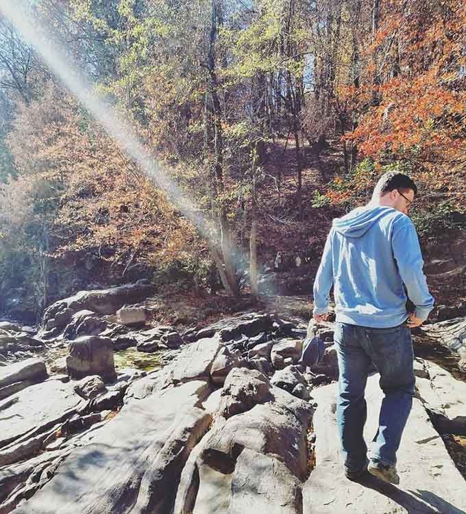 Standing on ancient rocks contemplating life, or more likely, what's for lunch after this hike.