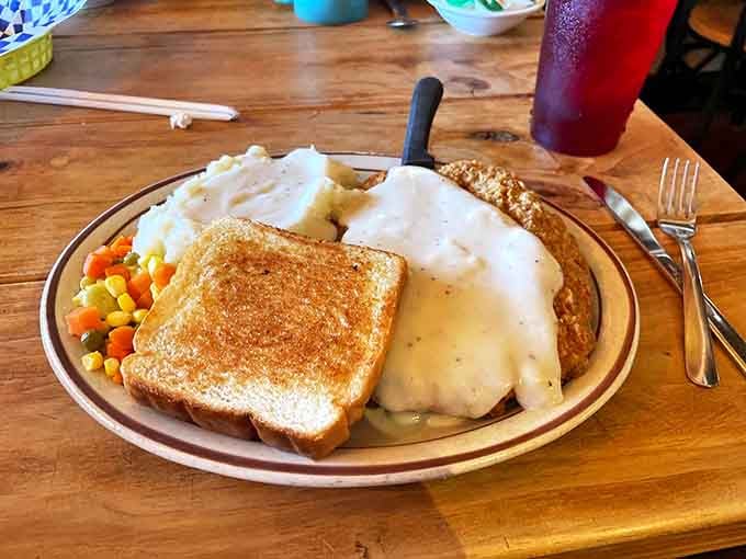 Behold: chicken fried steak nirvana. That golden-brown crust and river of country gravy could make a grown person weep with joy.