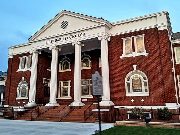 First Baptist Church combines red brick solidity with white column elegance&mdash;architectural proof that Sunday best isn't just for your closet.