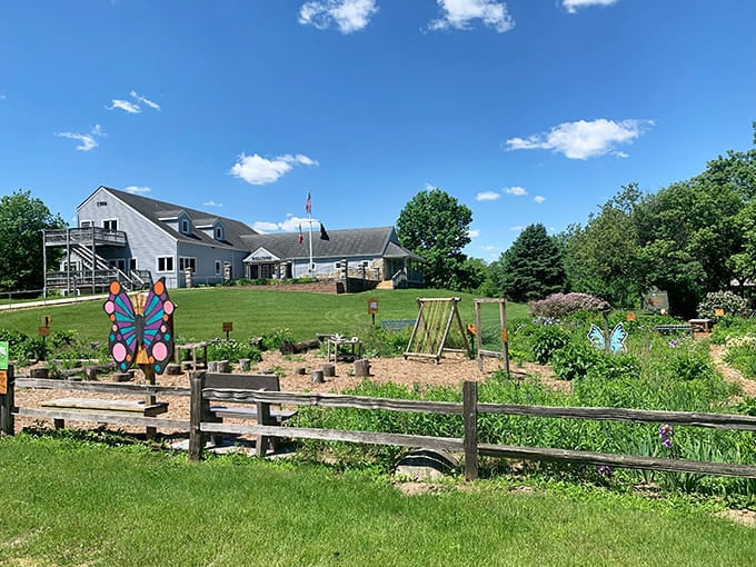 A community garden blooms with colorful whimsy at Clayton County Conservation, proving that butterflies and flowers make the best welcoming committee in Iowa.