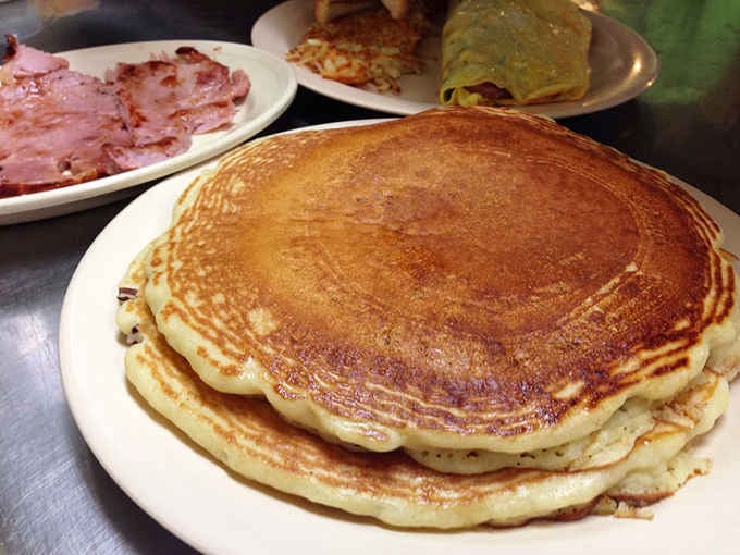 These golden pancakes are so fluffy they practically float off the plate, ready to soak up all that syrup.