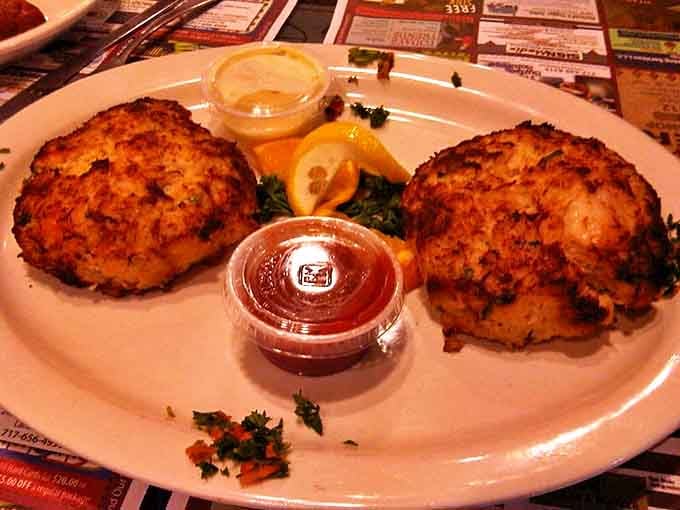 The legendary crab cakes in all their golden-brown glory. Like little seafood treasures waiting to be discovered with each bite.