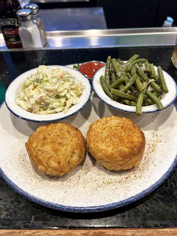 Golden-brown perfection! These crab cakes aren't playing around&mdash;they're what Maryland dreams are made of, with sides that know their role.