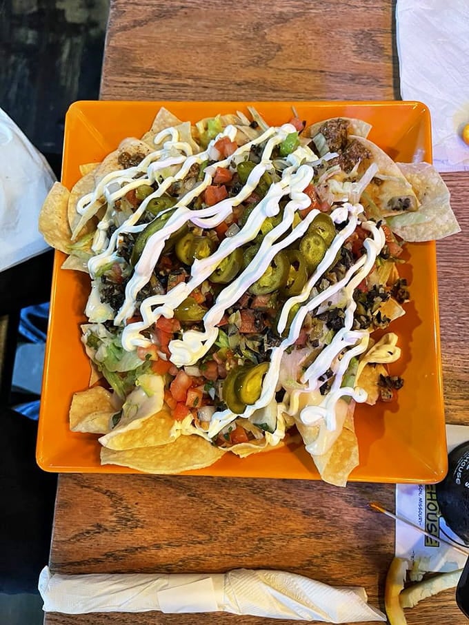 Nachos piled this high require both hands, zero shame, and possibly a forklift to navigate properly.