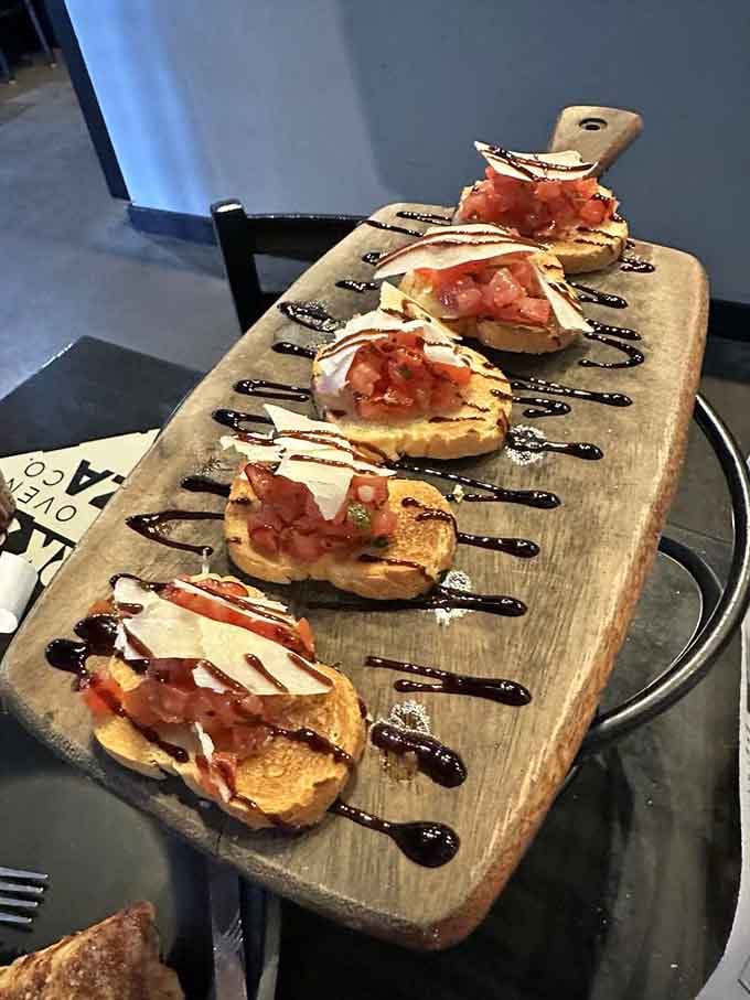 Bruschetta served on a wooden board with balsamic drizzle proves simple ingredients can create extraordinary moments.