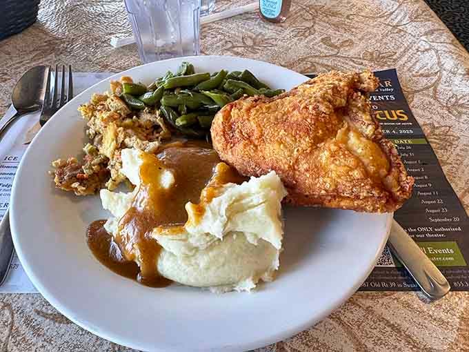 Golden fried chicken with all the fixings proves that some things in life are worth loosening your belt for.
