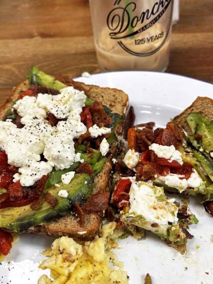 Avocado toast topped with goat cheese and bacon, because Donckers knows how mornings should start.
