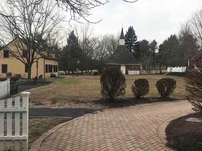 Brick pathways wind through history, connecting buildings that have stories older than your great-great-grandparents.
