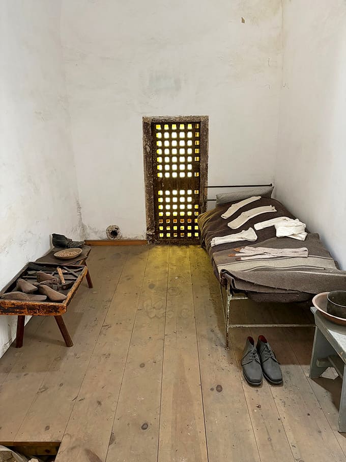 Even the most basic prison cell looks impossibly small when you're standing inside, contemplating what solitude really means.