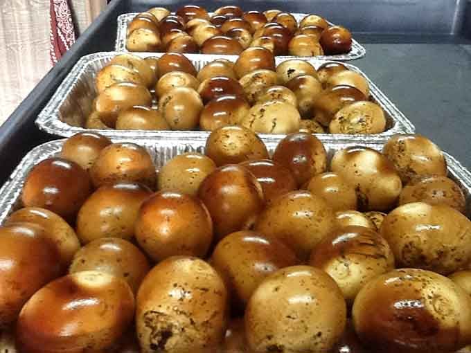 Golden-brown smoked eggs, looking like they've been kissed by the BBQ gods. These aren't your grandmother's deviled eggs—unless your grandmother was a genius.