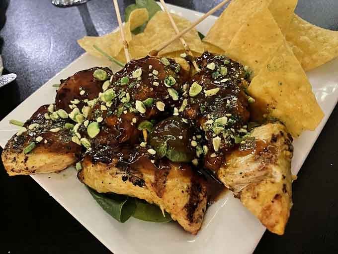 Grilled chicken elevated to art form, glazed and garnished with care that shows in every delicious bite.