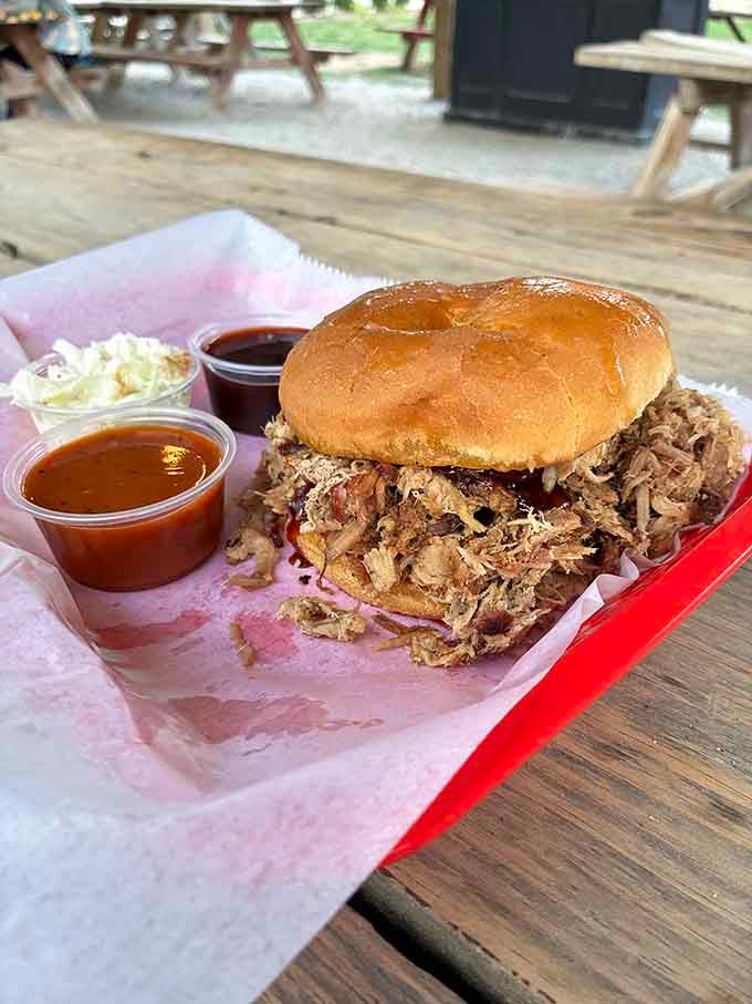 That pulled pork mountain on a bun will require structural engineering skills and approximately forty napkins.