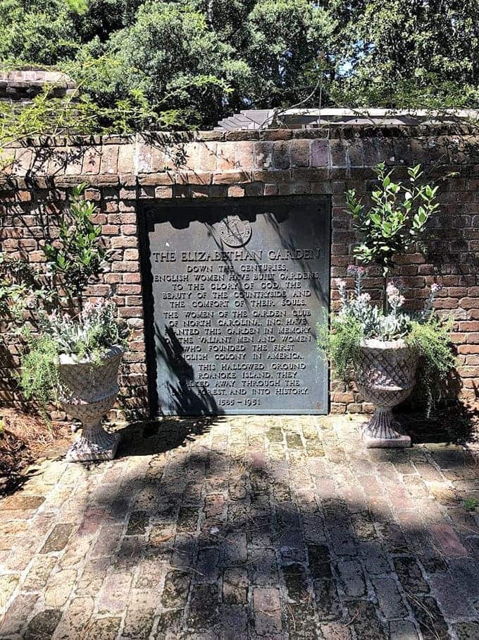 History carved in stone reminds us that gardens can honor the past while celebrating the present.