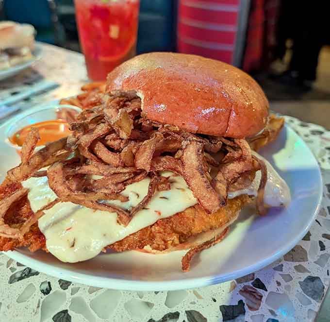 This towering creation of crispy onions and melted cheese makes you understand why people wait in Times Square lines.
