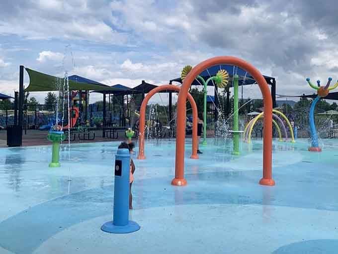 Those colorful arches aren't just pretty – they're water-spraying happiness machines for hot Alabama days.