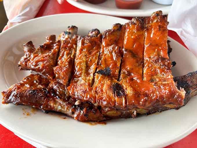 These glistening ribs look like they've been kissed by smoke and blessed by barbecue angels from above.