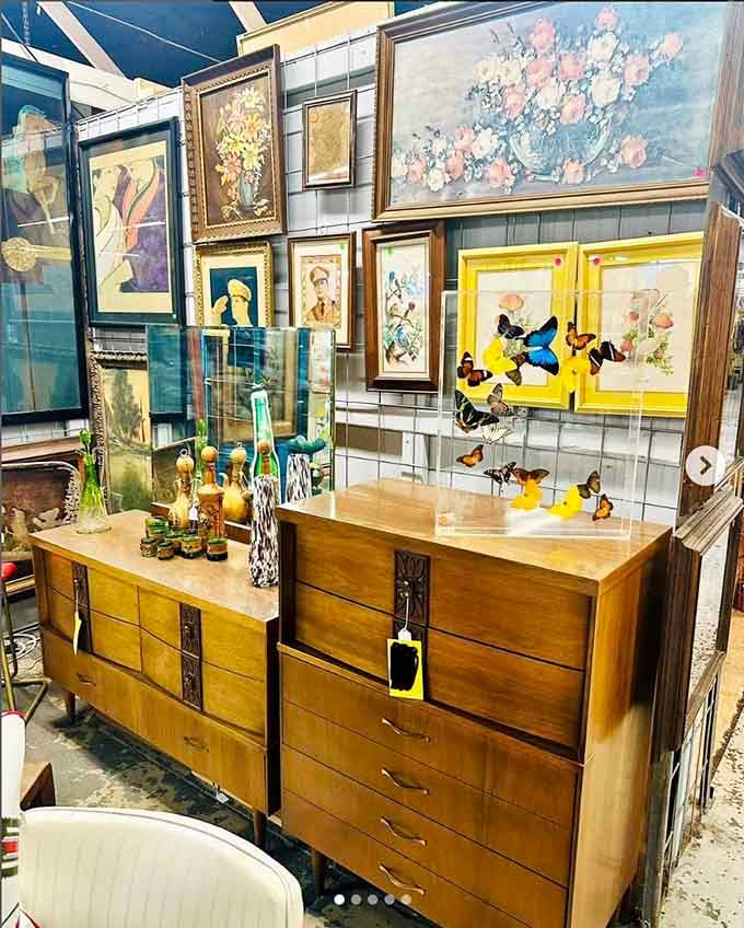 Mid-century modern furniture paired with vintage art creates a display that would make Don Draper weep with nostalgic joy.