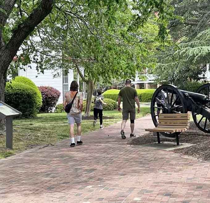 Families strolling past historic cannons and officers' quarters, where history lessons happen naturally between ice cream breaks and photo ops.