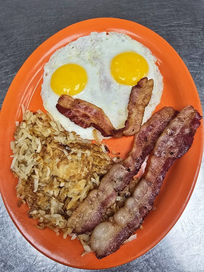 Two sunny-side eggs, crispy bacon, and golden hash browns prove simple perfection never goes out of style.