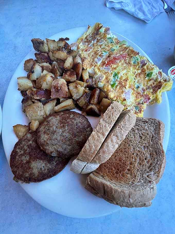 When your omelet needs its own zip code and the home fries could feed a small village.