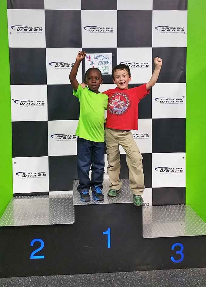 Victory tastes sweeter when you're standing on an actual podium, arms raised like Rocky on those Philadelphia steps.