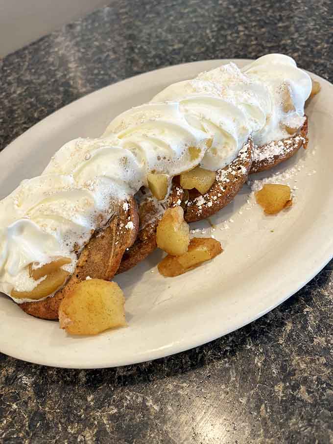 Apple cider donut French toast topped with whipped cream&mdash;because sometimes breakfast should taste like fall decided to party.