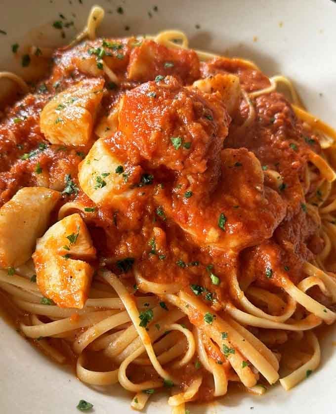 Shrimp swimming in red sauce over perfectly cooked linguine. This is what happiness looks like on a plate.