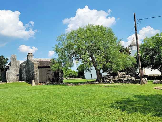 Stone ruins and green lawns at Goliad State Park offer peaceful spots for contemplation and picnics.